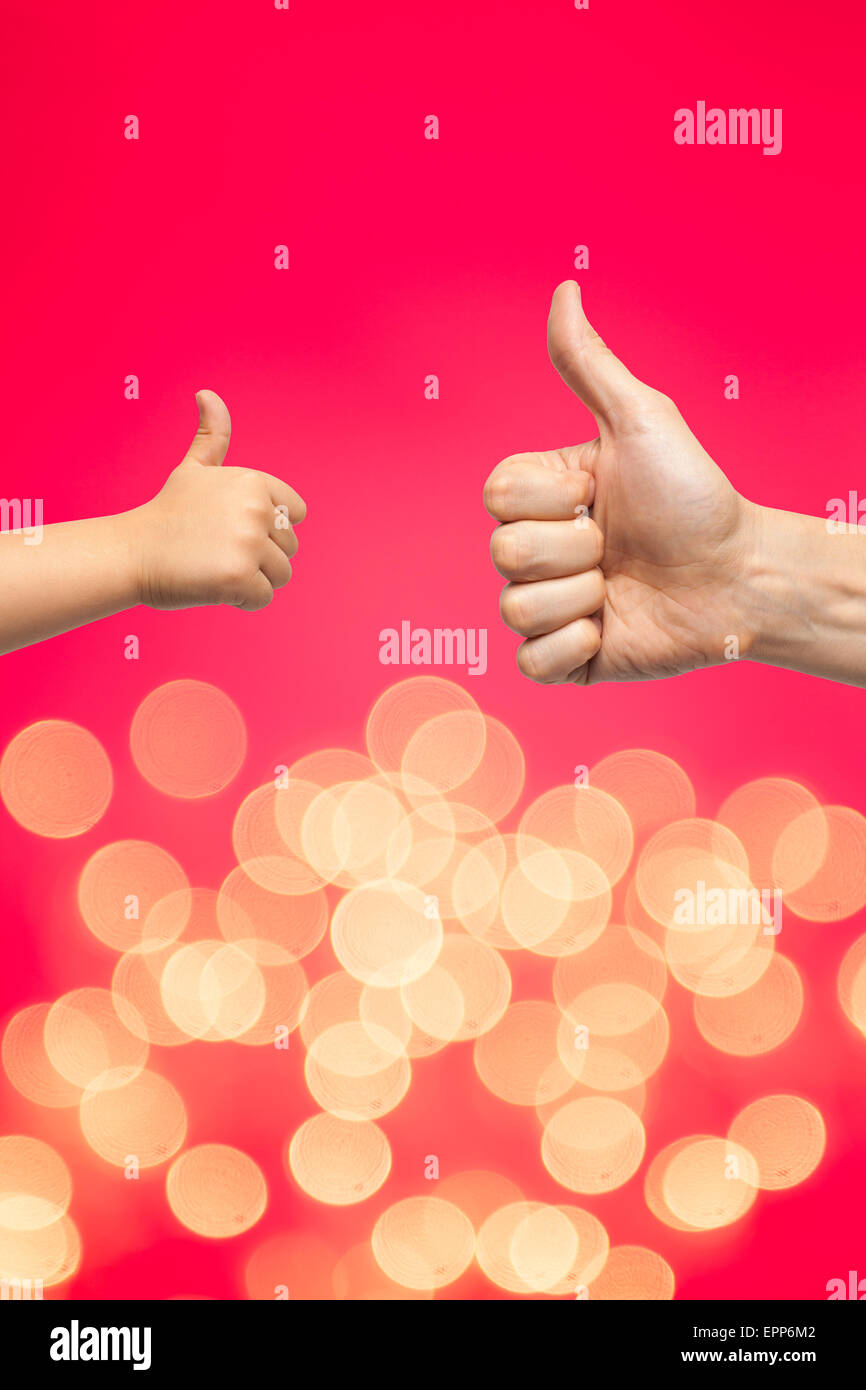 father and son hands giving like on christmas lights background Stock ...