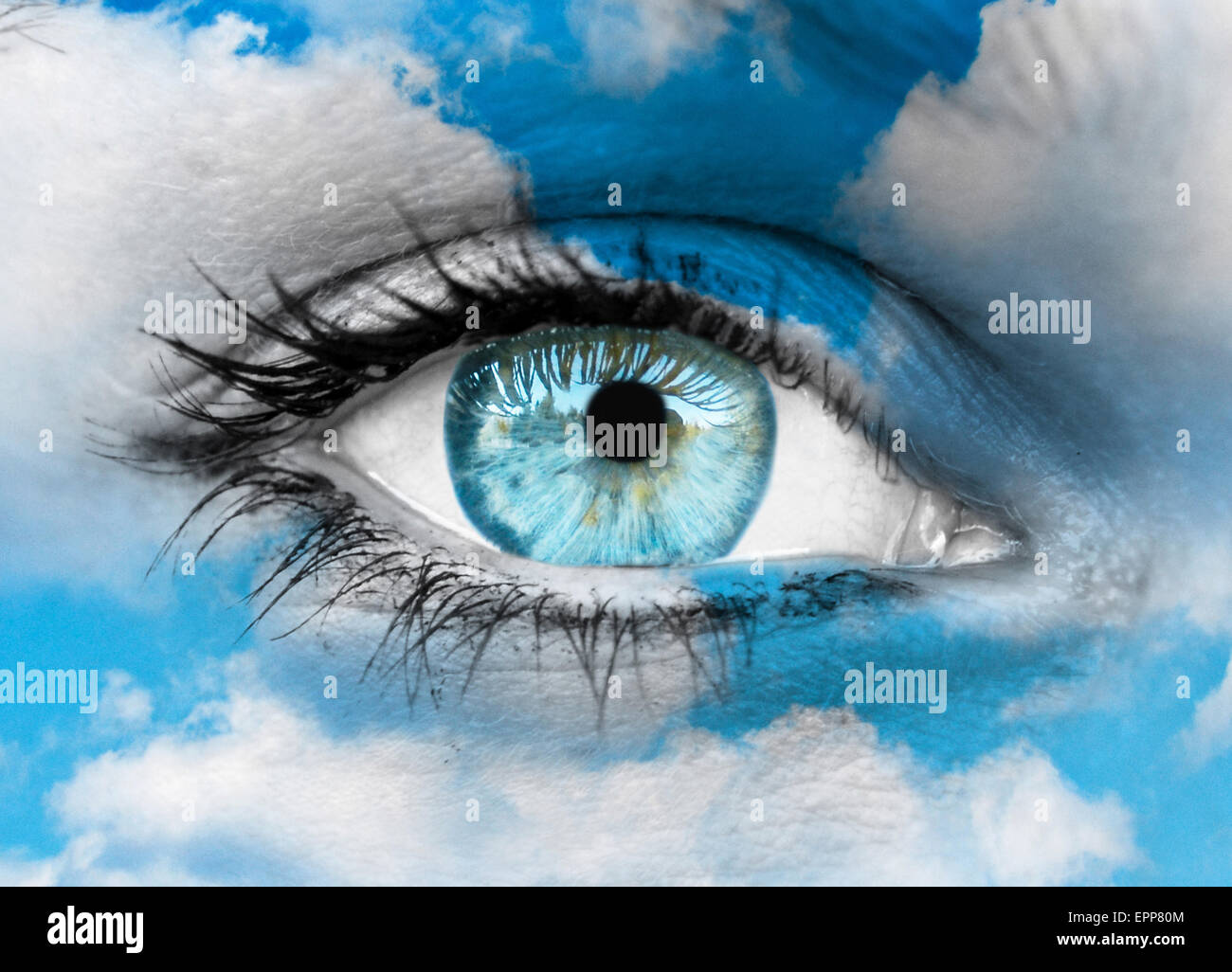 Beautiful blue eye against blue clouds - Spiritual concept Stock Photo ...