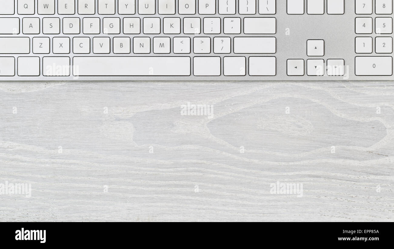 White office table with computer keyboard. Top view with plenty of copy ...