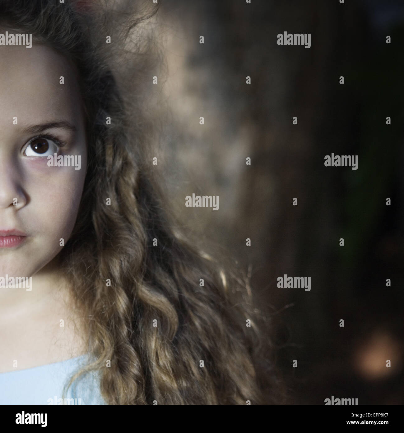 Cropped front view portrait of a young girl looking up Stock Photo - Alamy