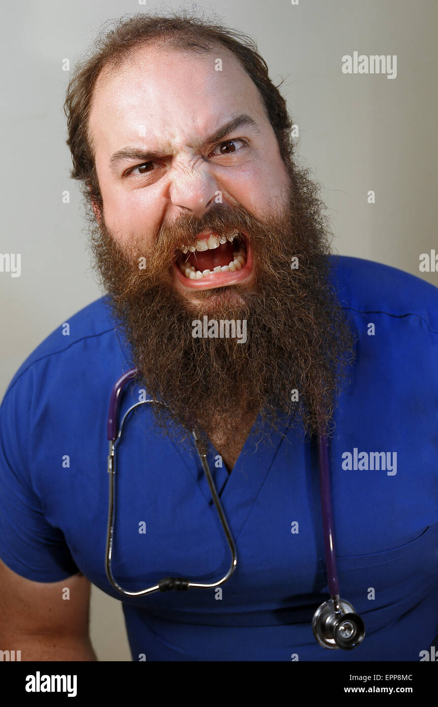 An angry nurse growls at the camera Stock Photo - Alamy