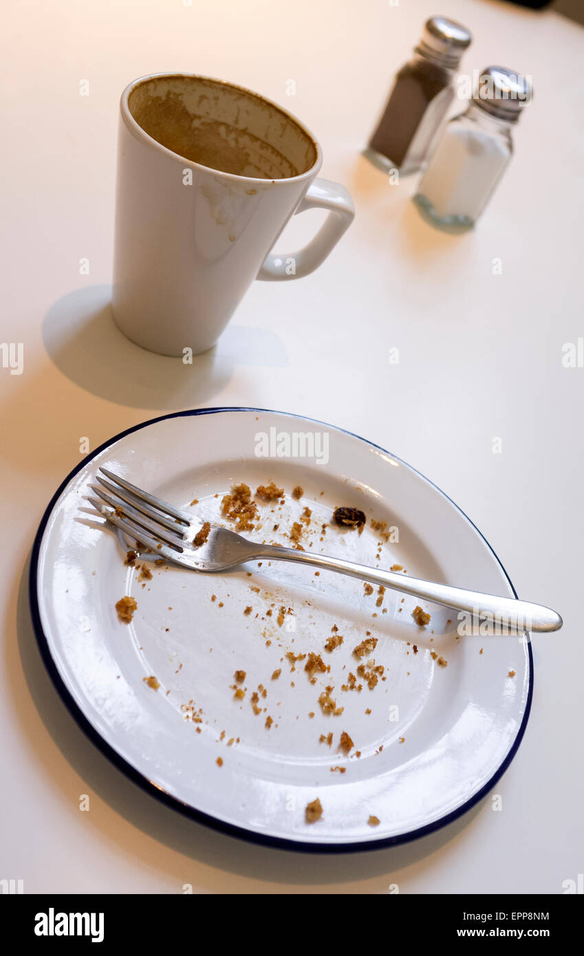 Empty Plate and Mug on Cafe Table Stock Photo - Alamy