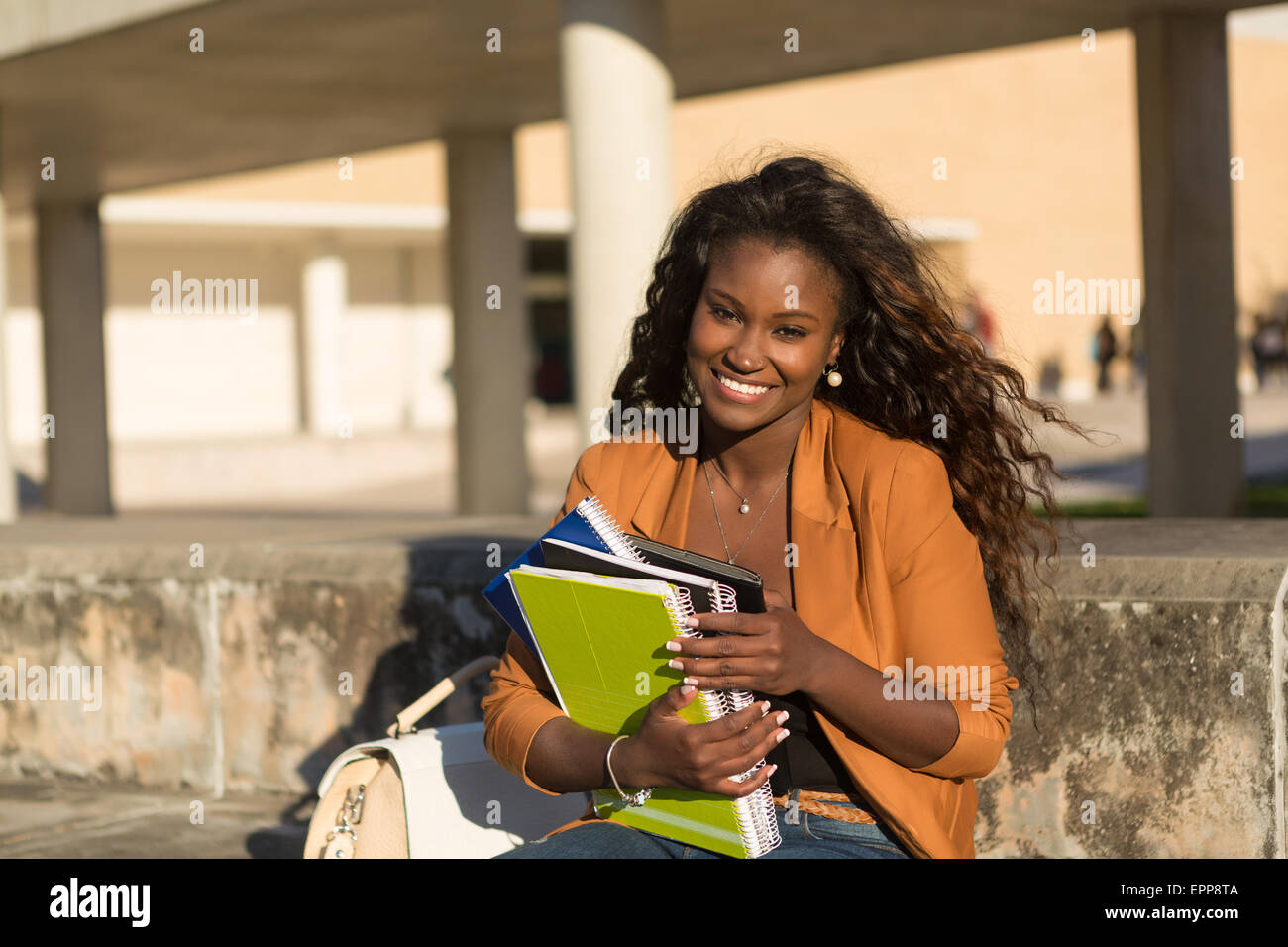Happy student relaxing at the university campus Stock Photo - Alamy