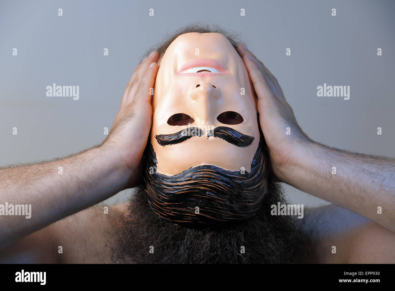 A man is losing his mind and proceeds to rip his own head off Stock ...