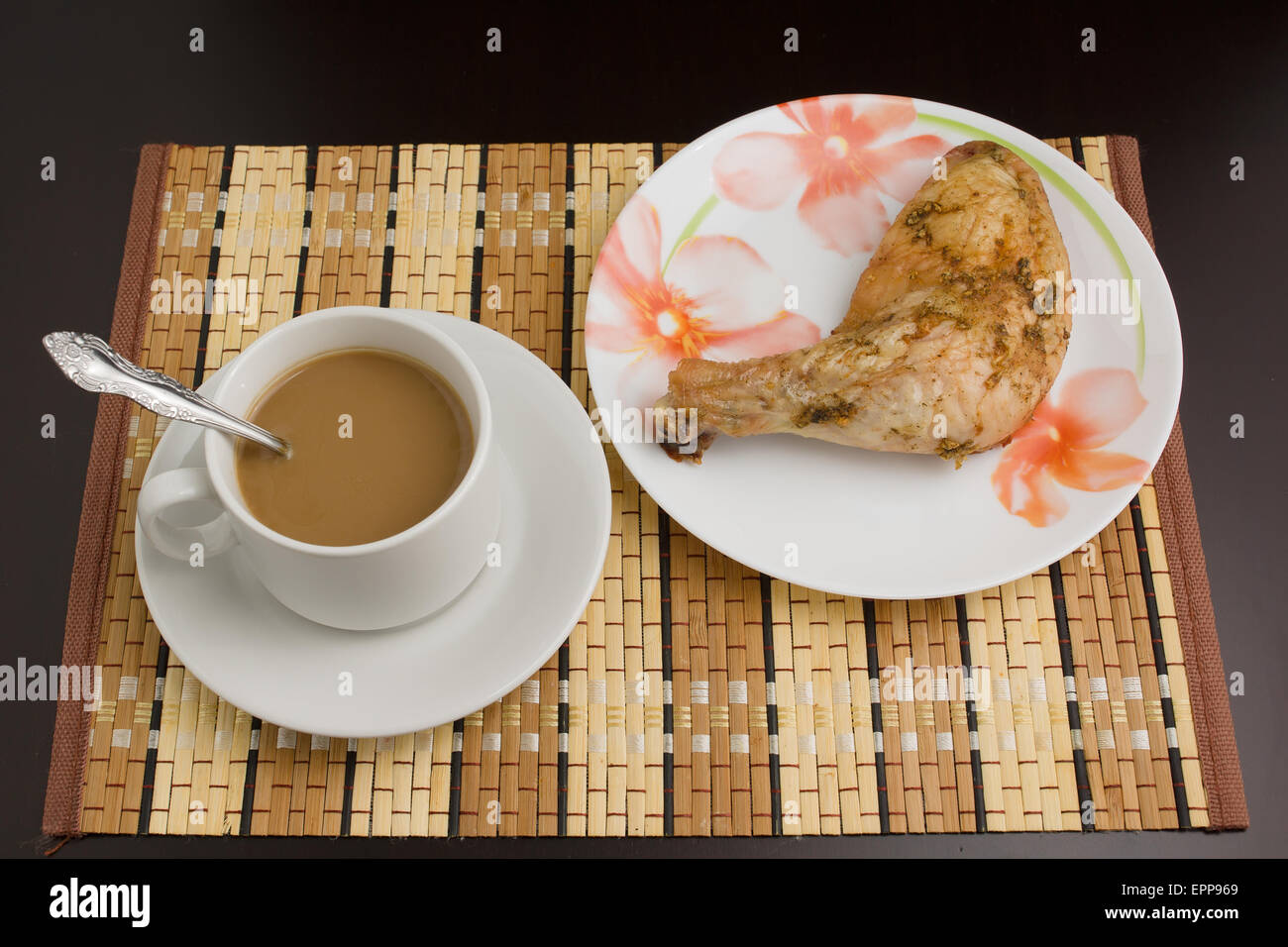 morning coffee in a white mug and chicken ham on a plate stand on a ...