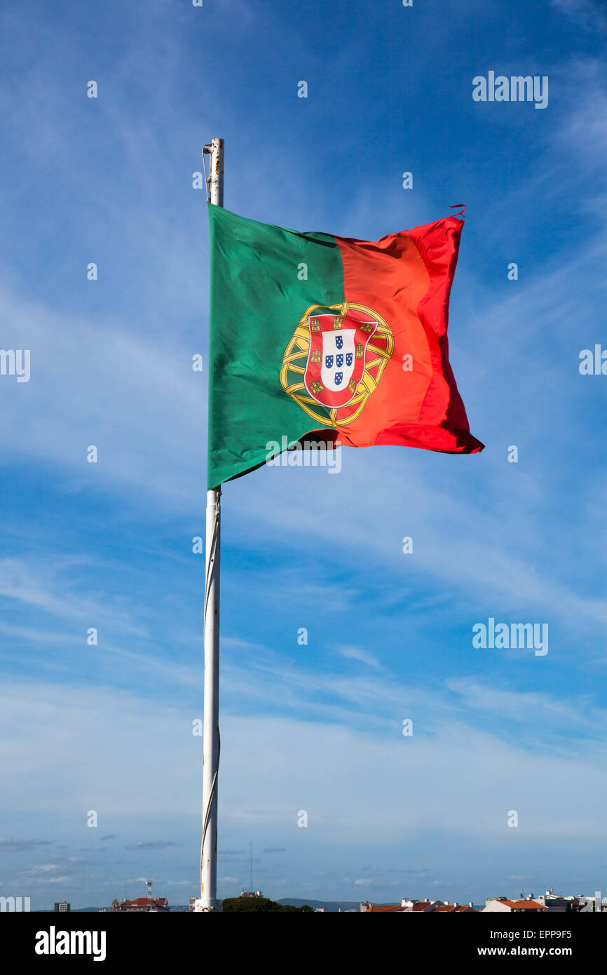 Portugal flag waving on the wind over a cloudy blue sky Stock Photo - Alamy