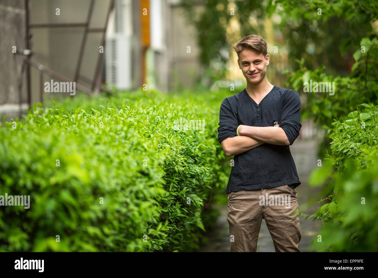 Young charming guy standing outdoors Stock Photo - Alamy