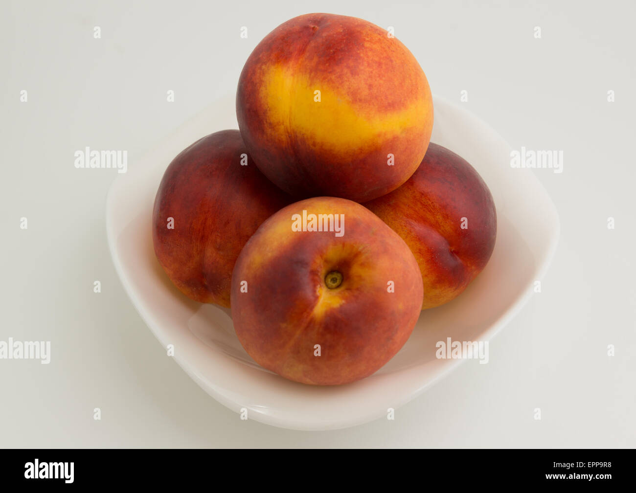 Plate peaches hi-res stock photography and images - Alamy