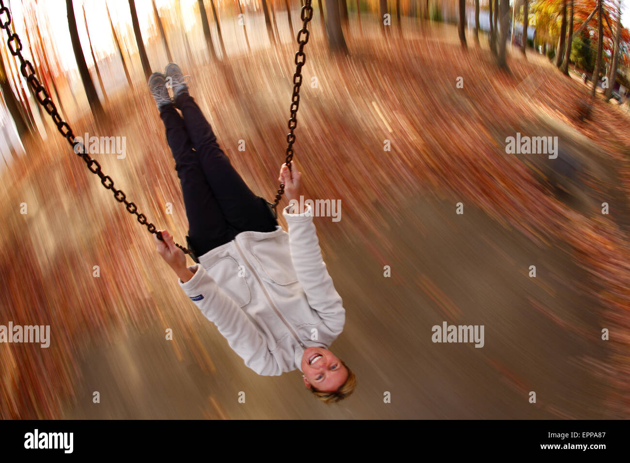 Swing-mounted remote camera captures a blur motion image of a girl on ...