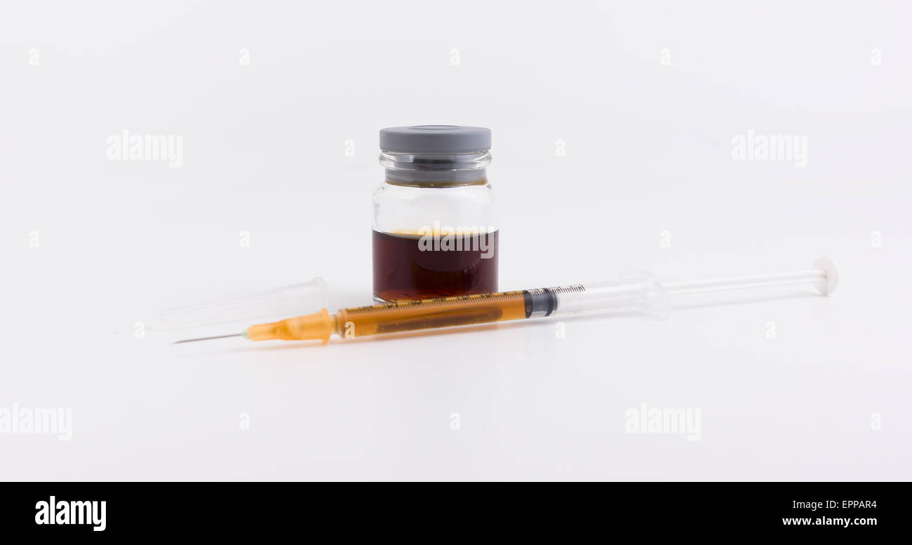 medical syringe and medicine liquid in a small bottle Stock Photo - Alamy