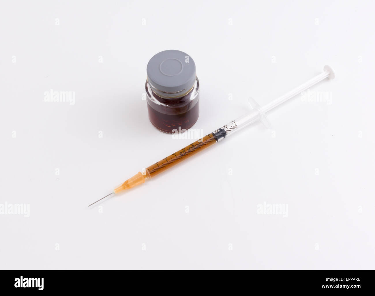 medical syringe and medicine liquid in a small bottle Stock Photo - Alamy