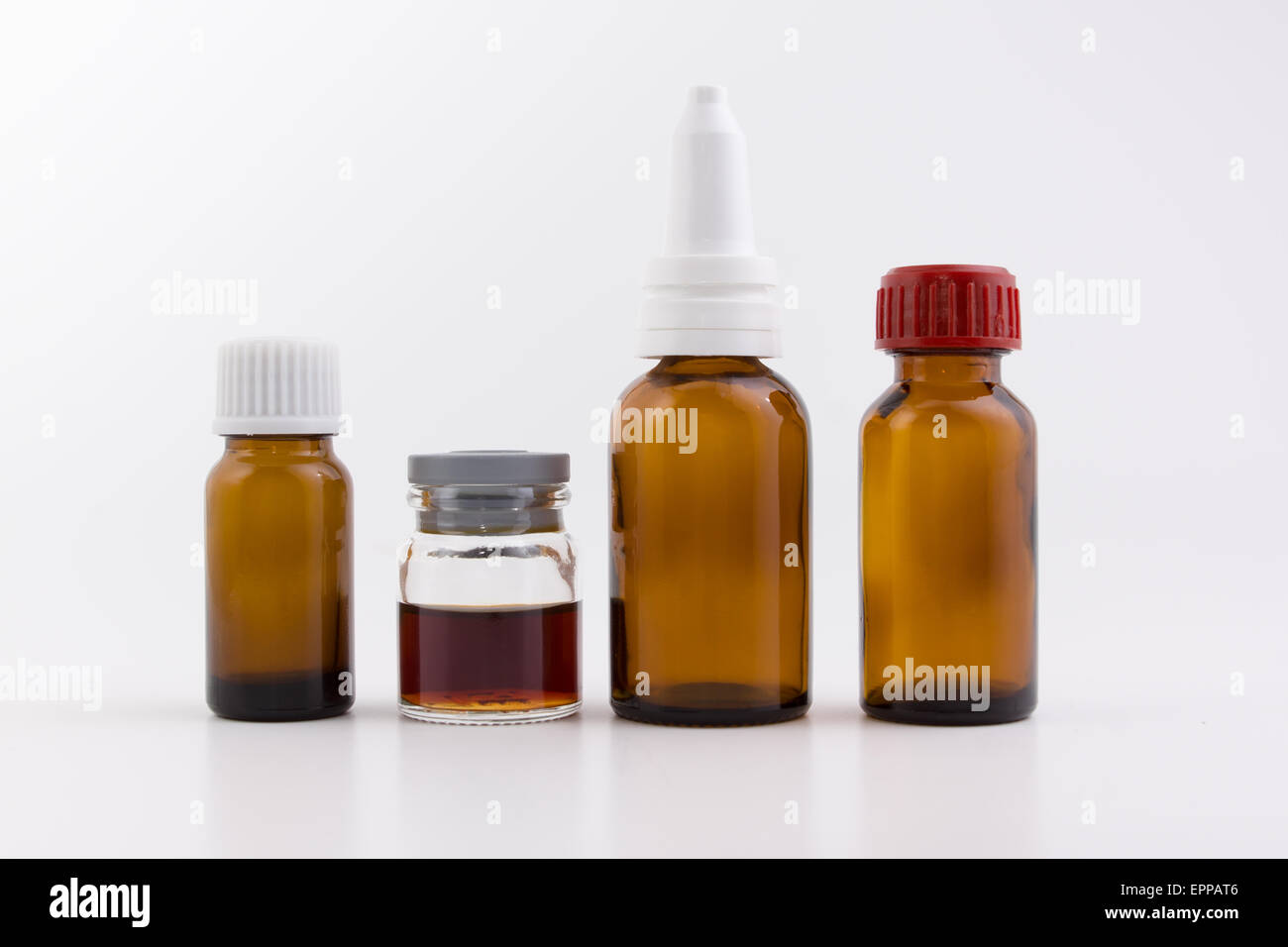 some empty medical small bottles on a white background Stock Photo - Alamy