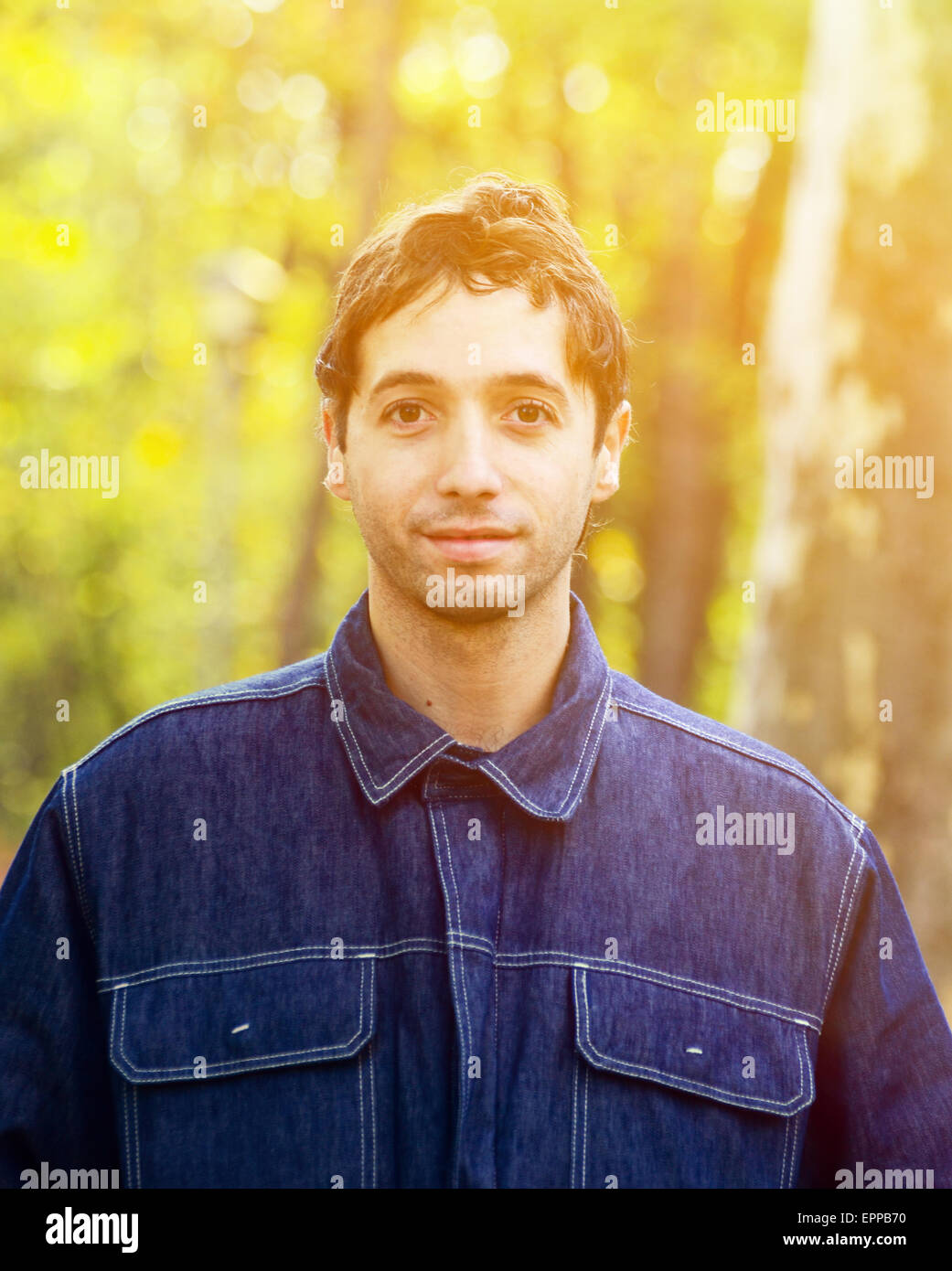 Portrait of young man in nature Stock Photo - Alamy