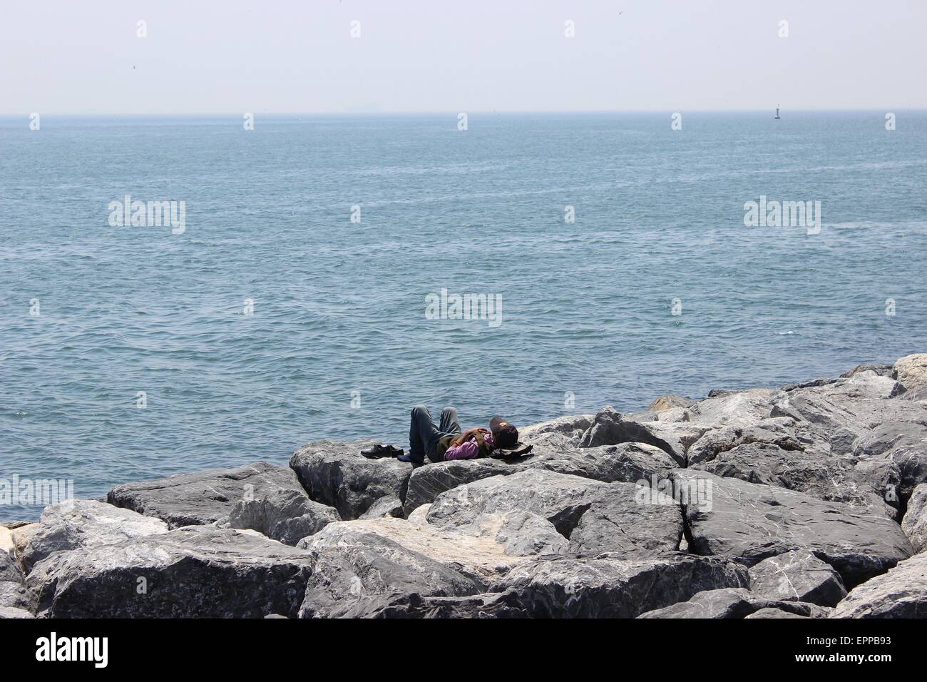 Man sleeping on rocks hi-res stock photography and images - Alamy