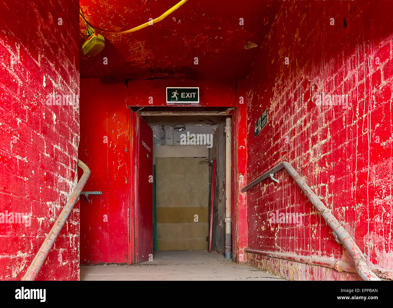 Destroyed staircase with emergency exit in an old building Stock Photo ...