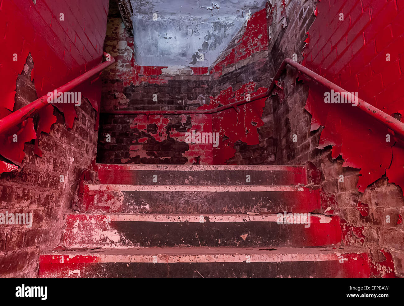 Destroyed staircase with emergency exit in an old building Stock Photo ...