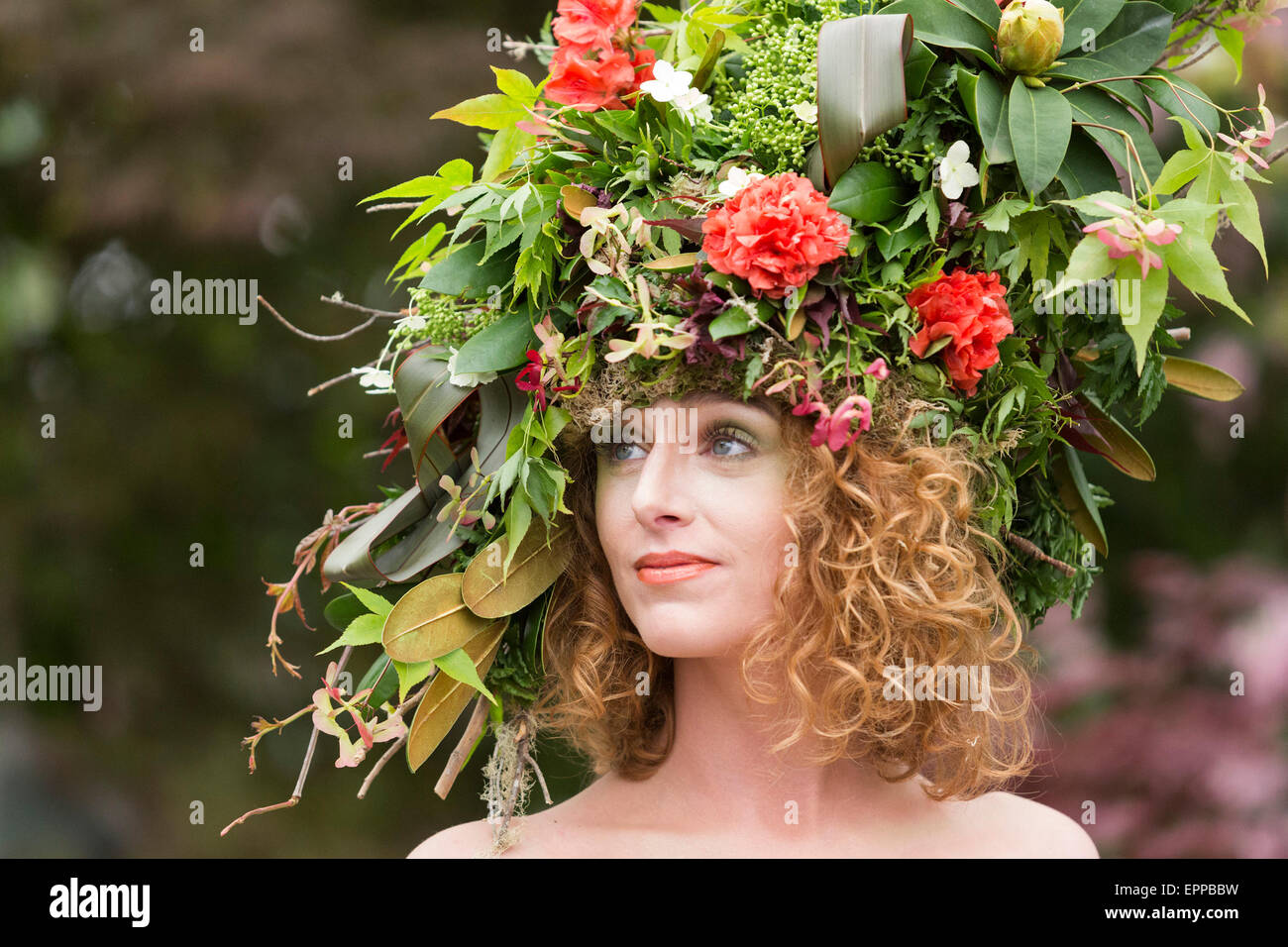RHS Chelsea Flower Show, portrait of a model with a large floral ...