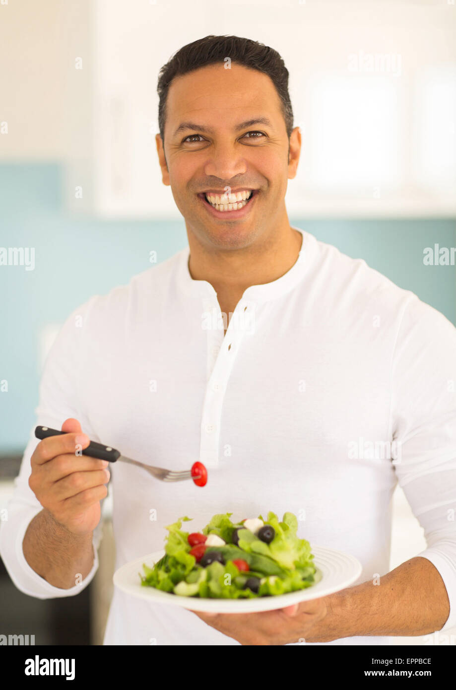 Happy man eating salad hi-res stock photography and images - Alamy