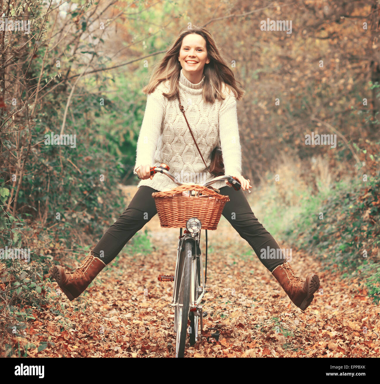 Beautiful woman enjoying nature driving bicycle Stock Photo - Alamy