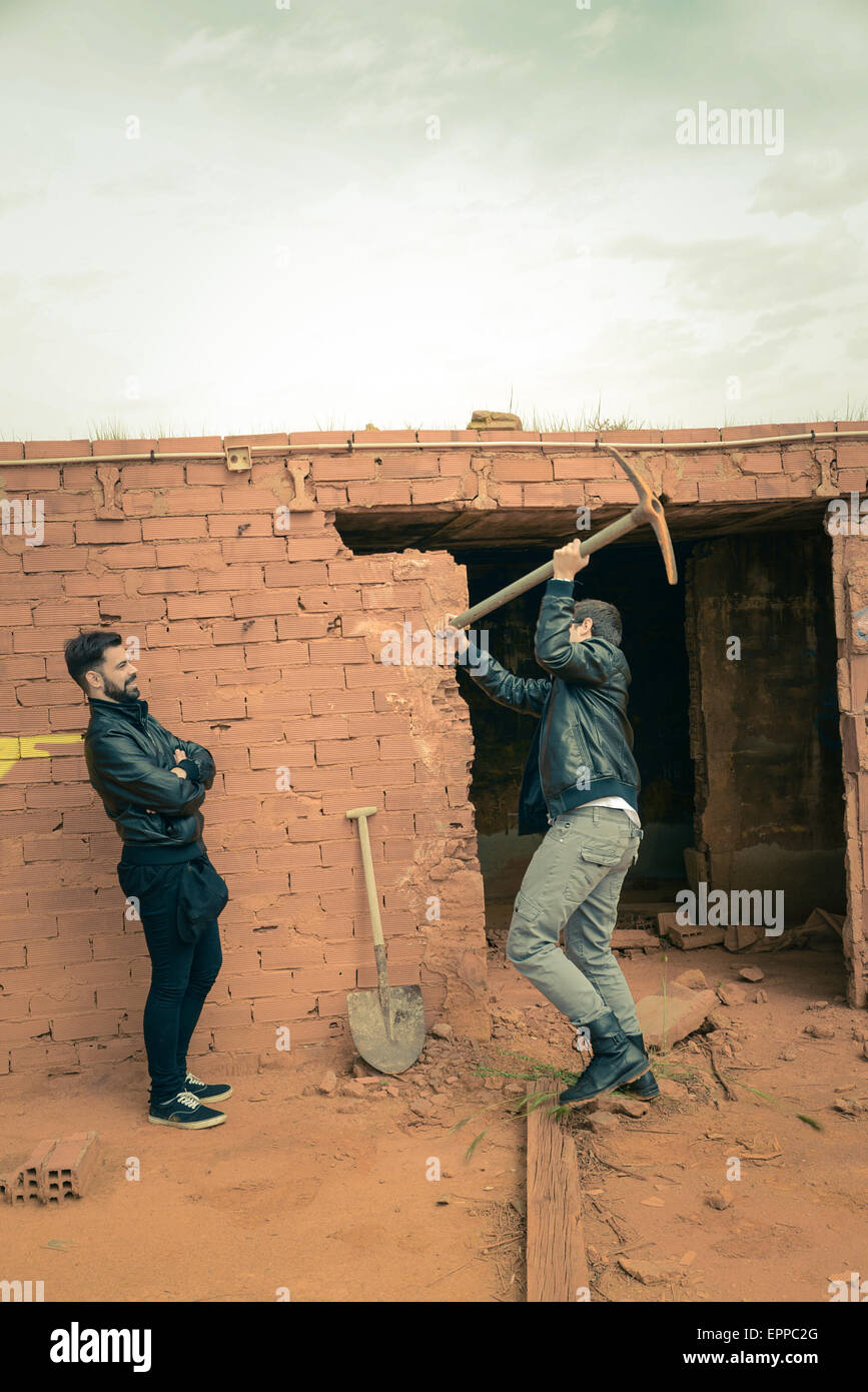 Pulling down wall hi-res stock photography and images - Alamy