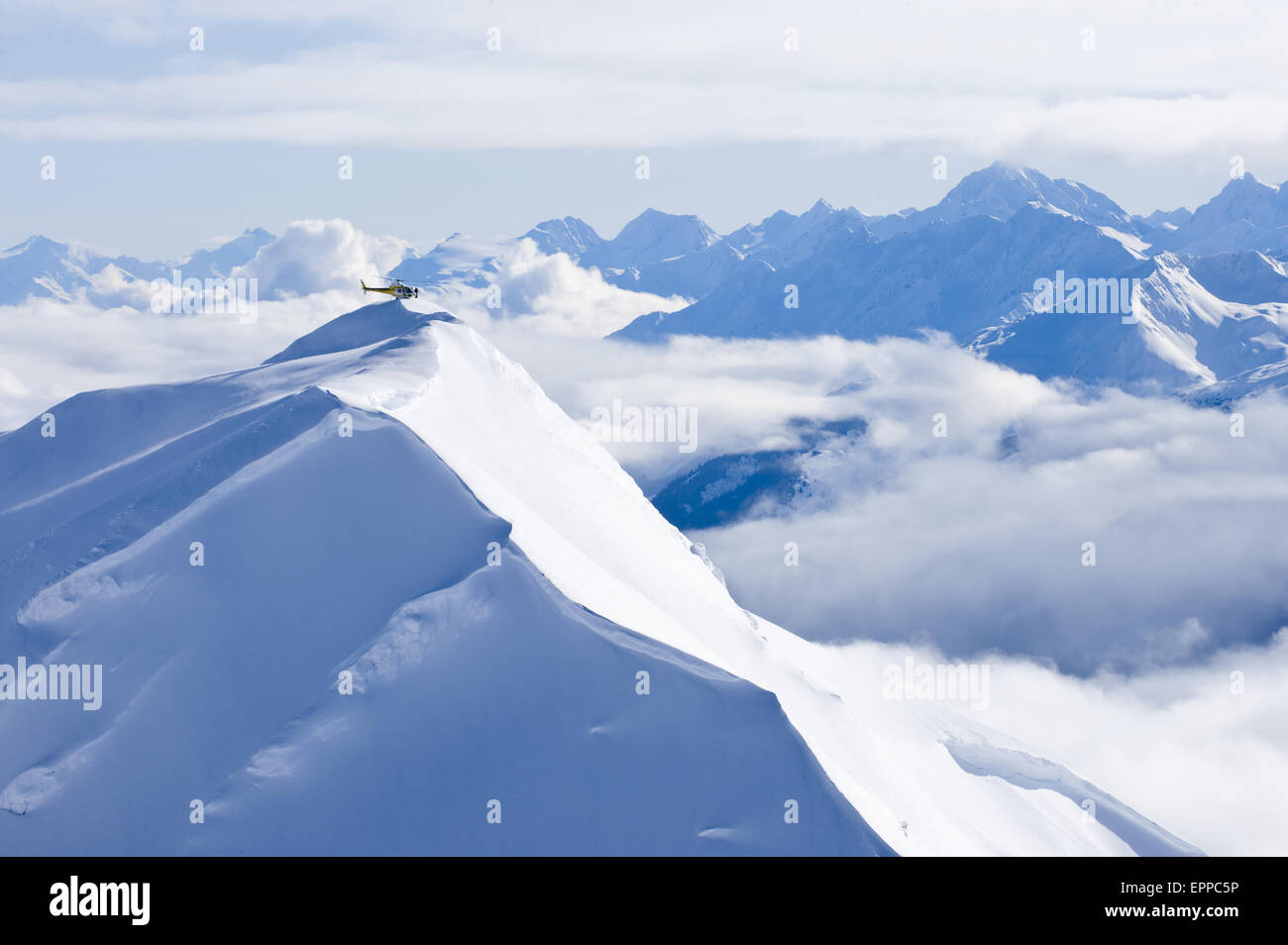 Coastal Helicopter flying over Chilkat Mountains in Haines, Alaska ...