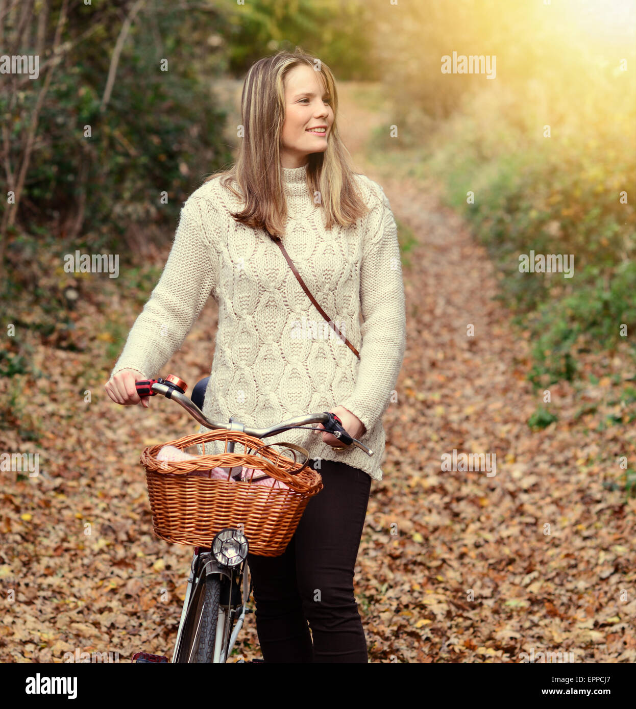 Beautiful woman enjoying nature driving bicycle Stock Photo - Alamy