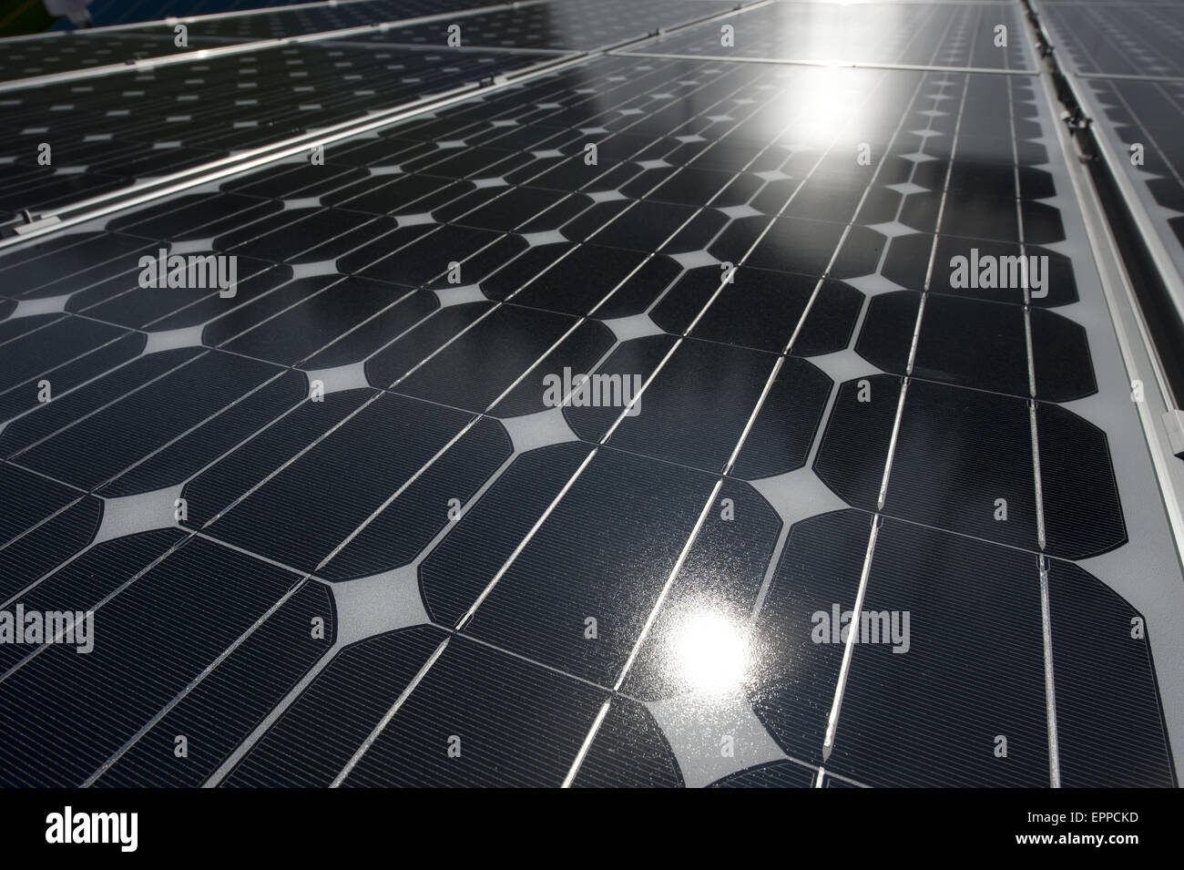 Closeup of a photovoltaic panel with the sun reflecting Stock Photo - Alamy