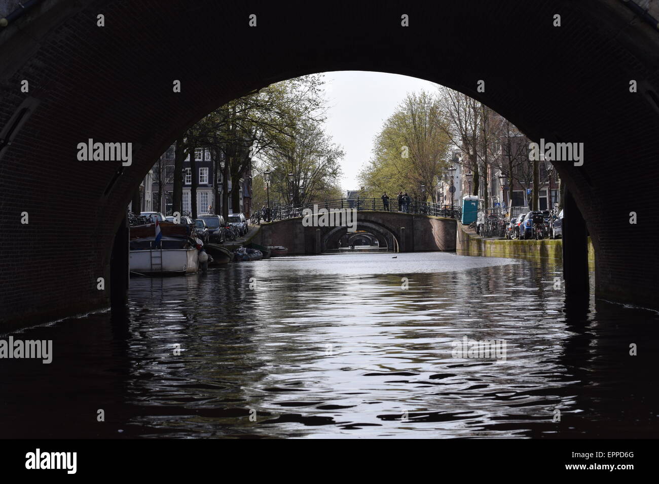 Canal and arched bridges in Amsterdam Stock Photo - Alamy
