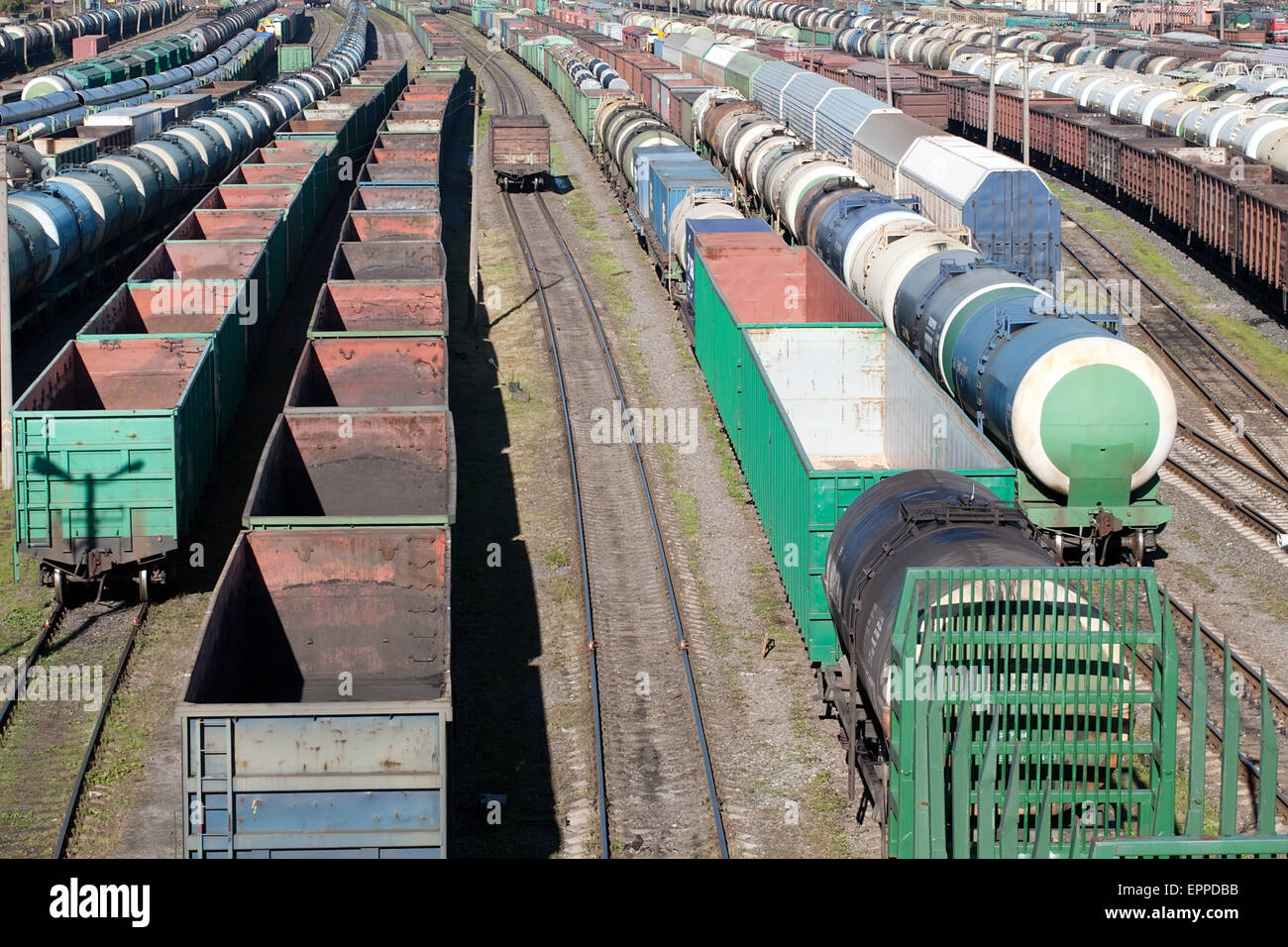 big railway cargo station junction with a lot of trains and track lines ...