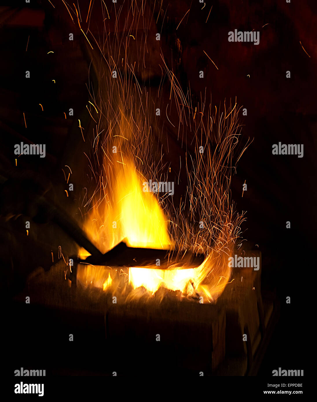 smithy fire flame tips with sparks closeup on dark background Stock ...