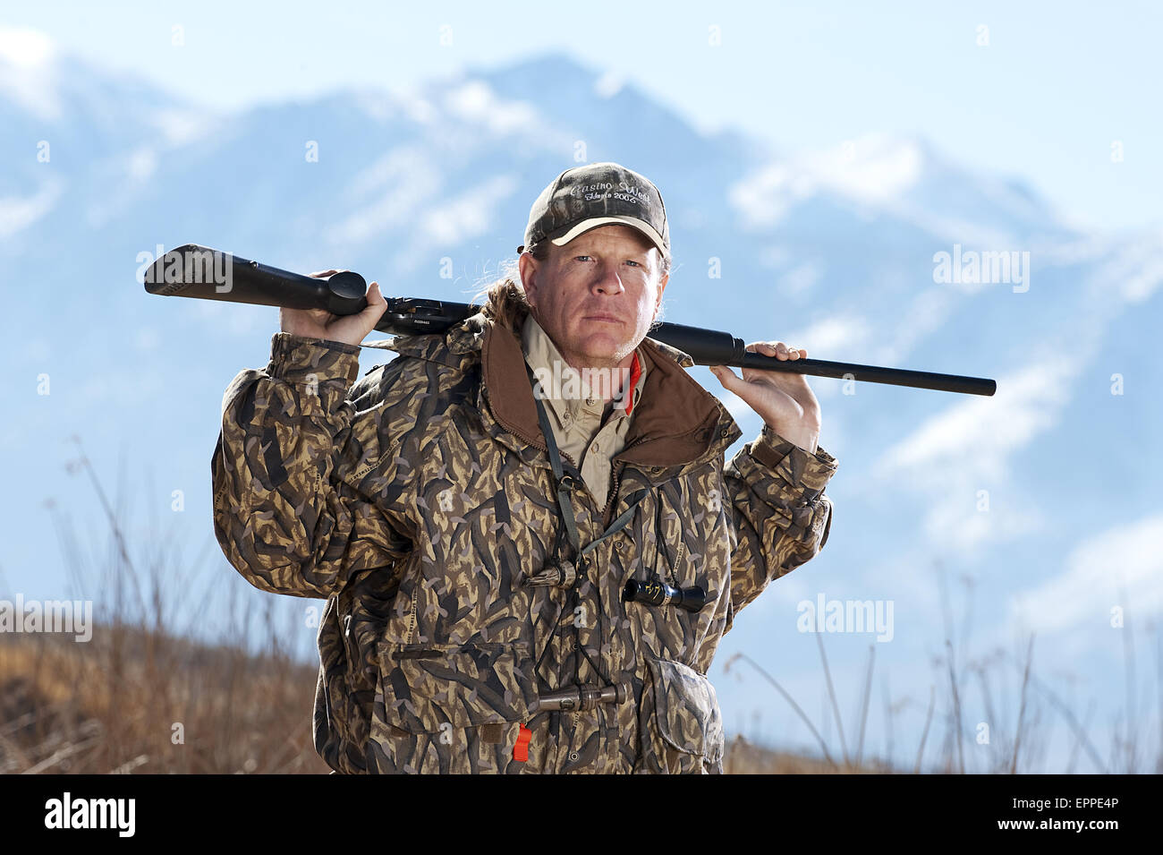 A hunter poses with his shotgun in Nevada Stock Photo - Alamy