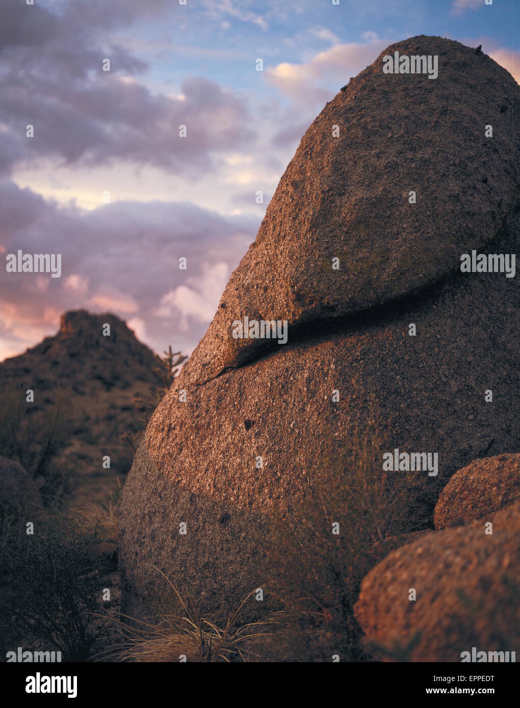 A large boulder catches the last light in the Manzano Open Space ...