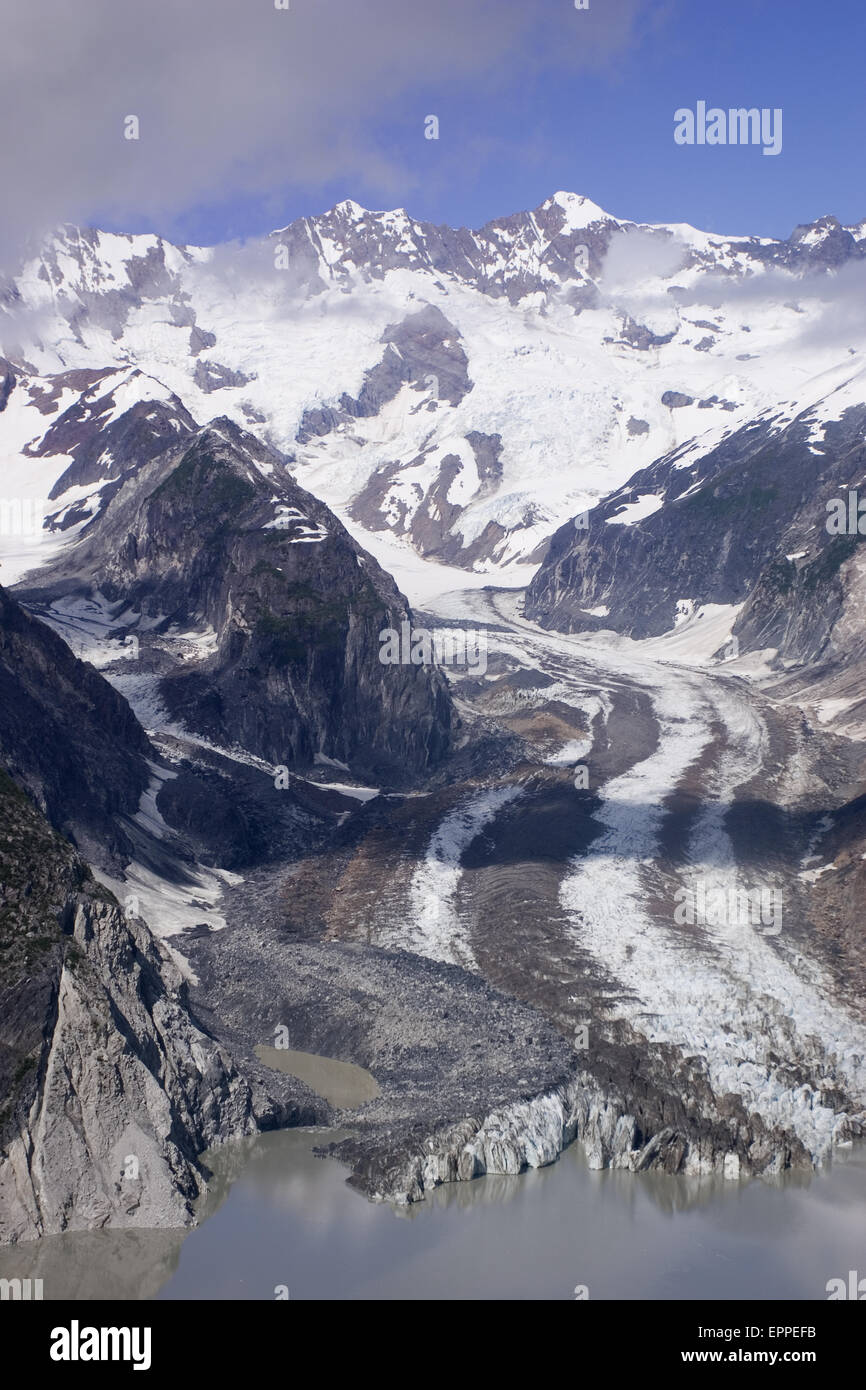 A glacier entering a silty lake, Glacier Bay National Park, Alaska ...