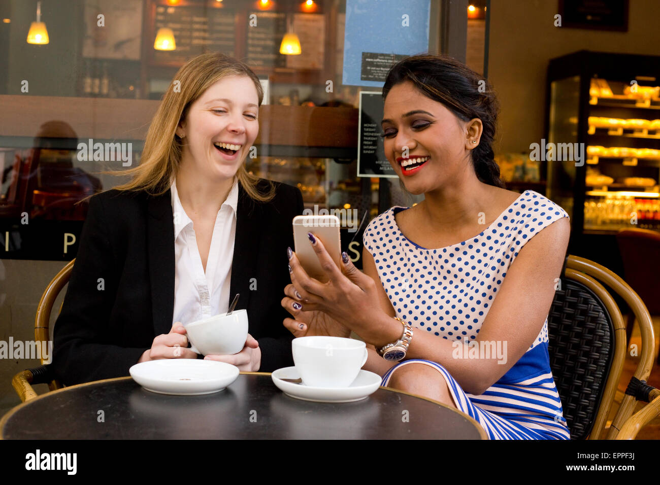 happy ladies enjoying a coffee Stock Photo - Alamy