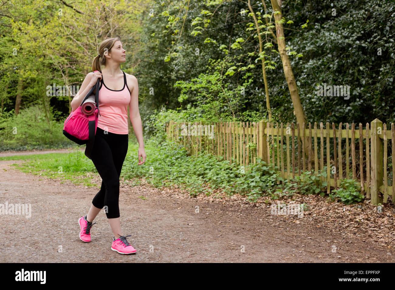 Woman walking home alone hi-res stock photography and images - Alamy