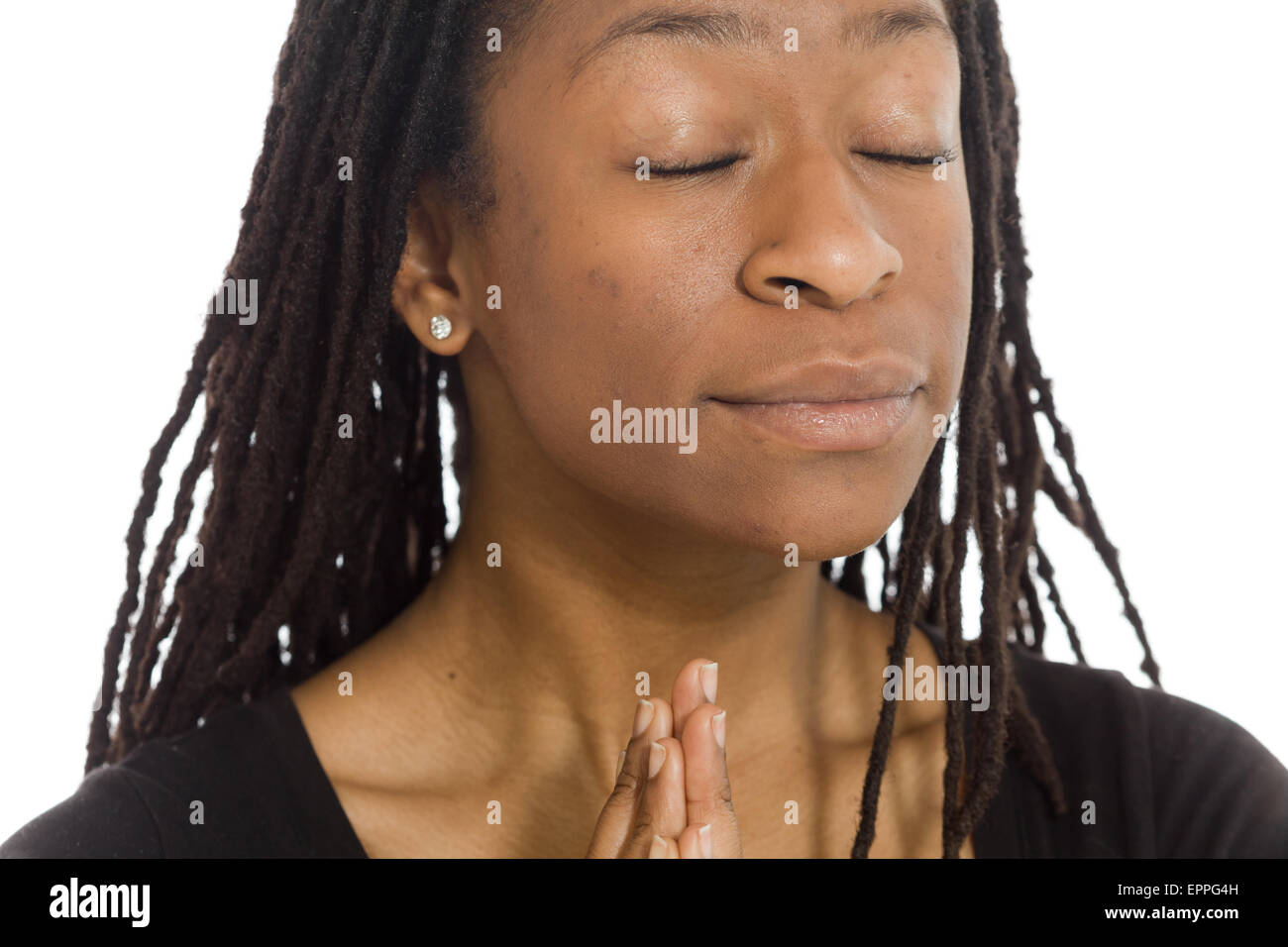 Model isolated on plain background in studio wishing praying Stock ...