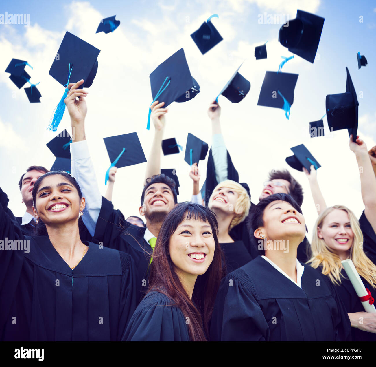 Graduation caps in air hi-res stock photography and images - Alamy
