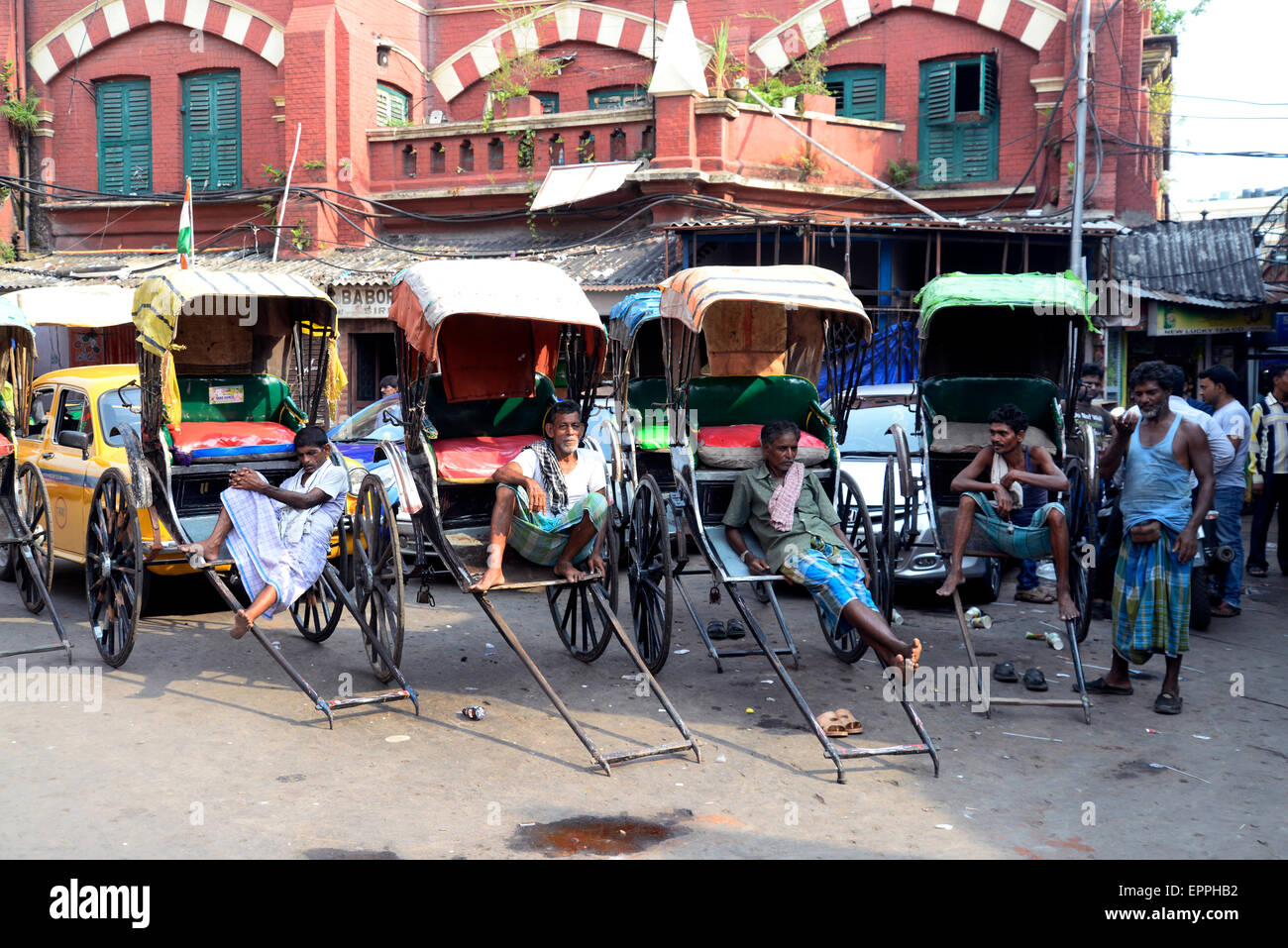Kolkata, India. 20th May, 2015. Hand pulling rickshaw pullers waiting ...