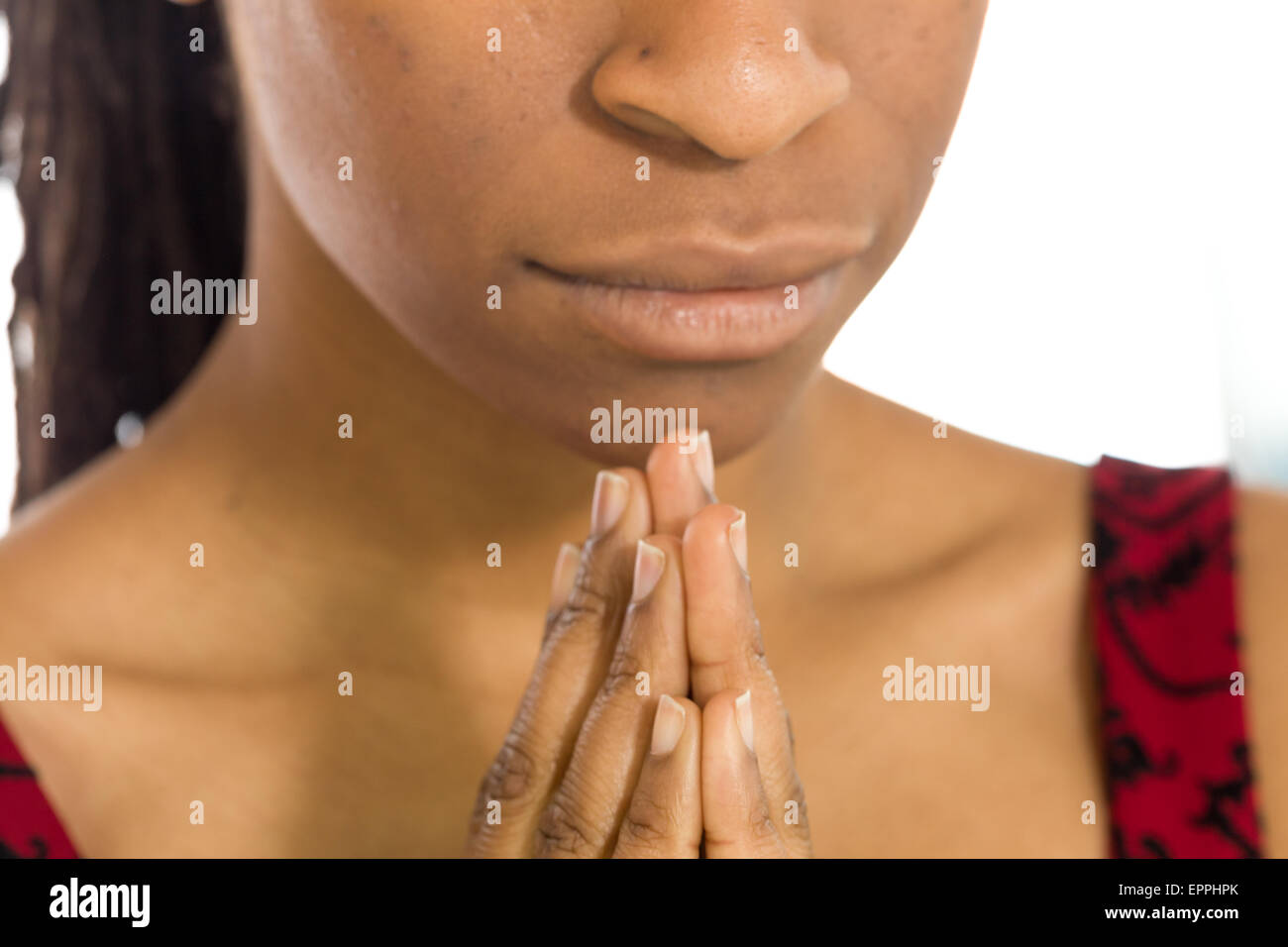 Model isolated on plain background in studio wishing praying Stock ...