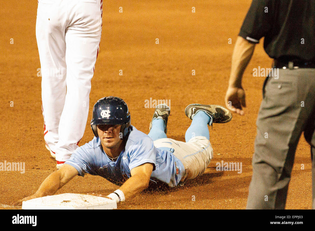 infielder Alex Raburn (6) of the North Carolina Tar Heels slides into ...