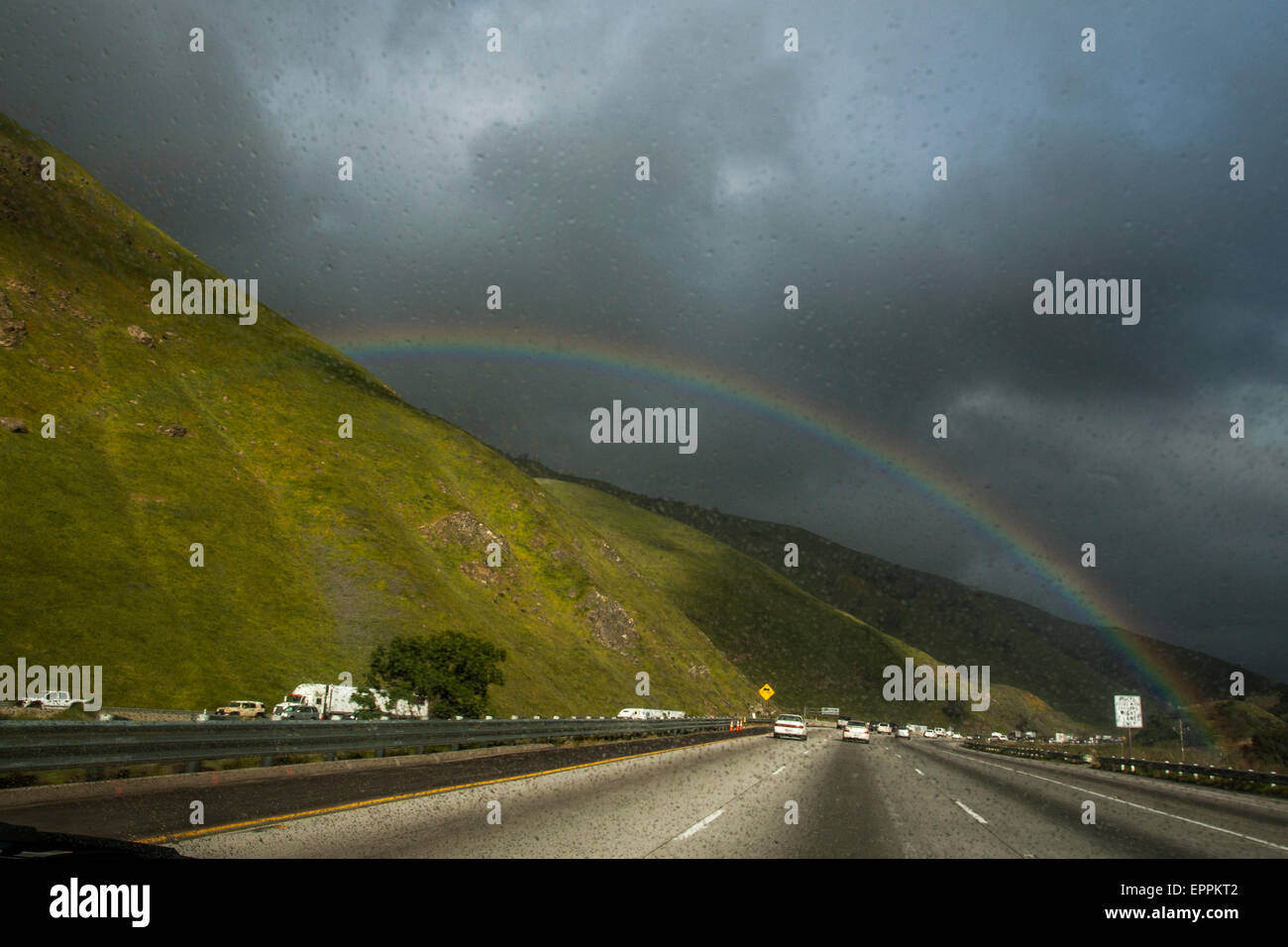 Patch of sun and rainbow in Grapevine section of interstate 5 ...