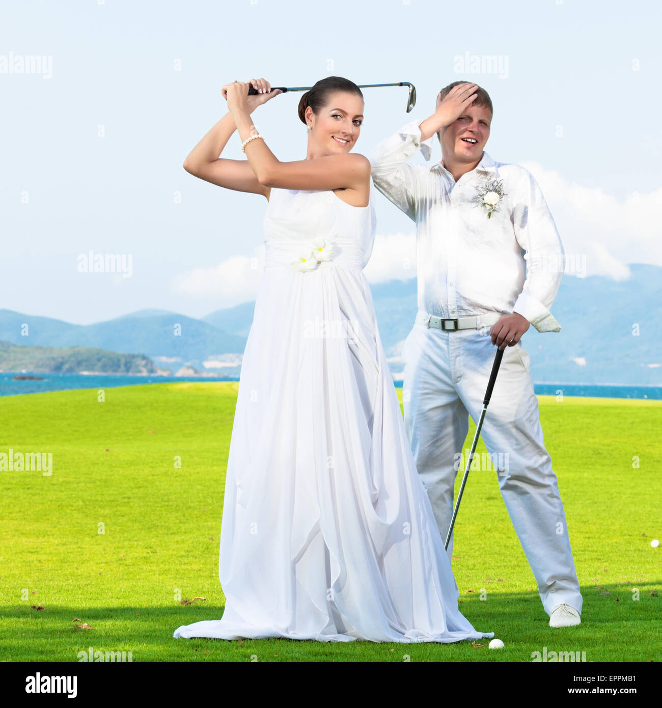 Bride and groom are playing golf at wedding day Stock Photo - Alamy
