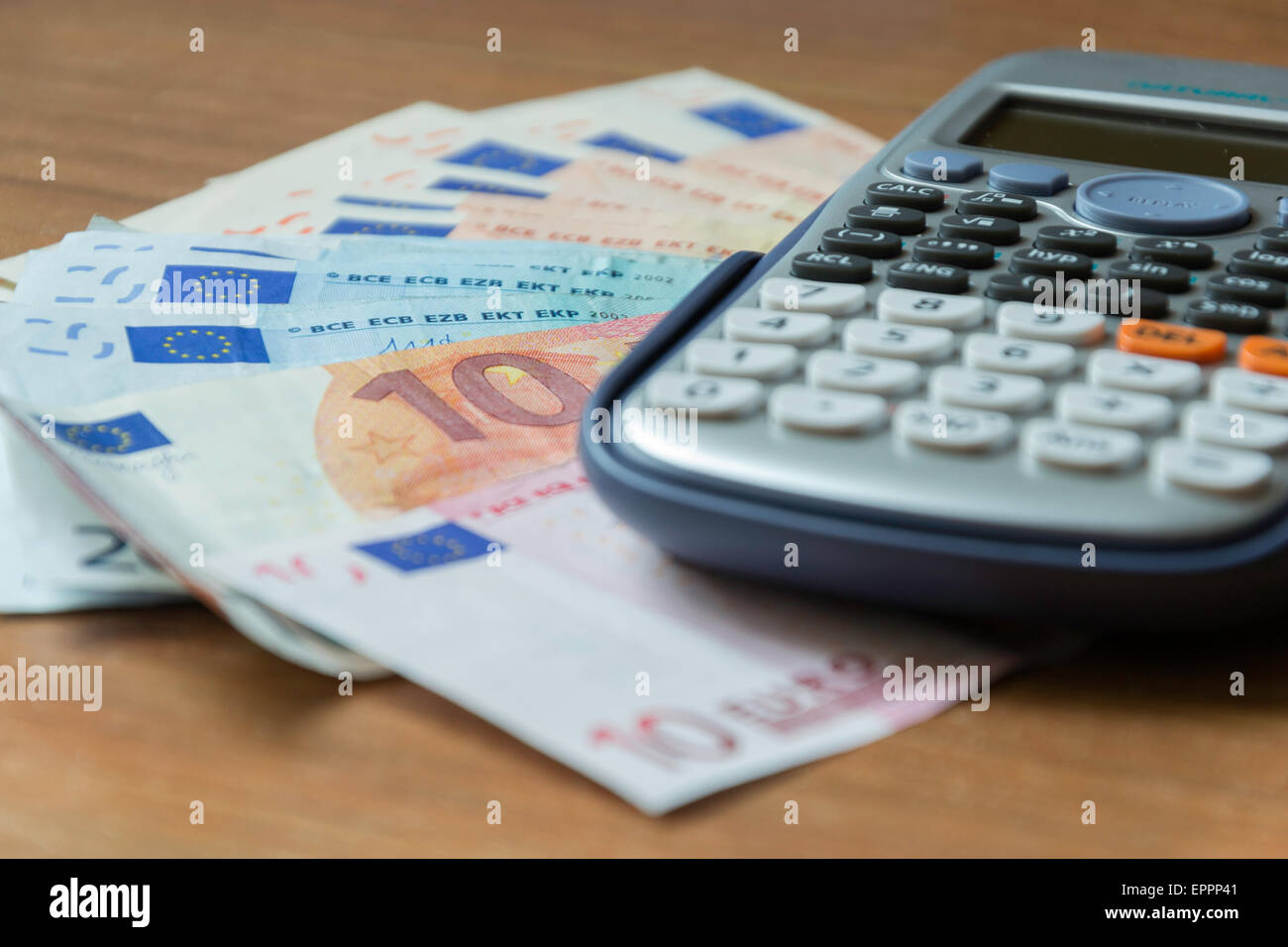 concept of savings analysis with banknotes and a calculator Stock Photo ...