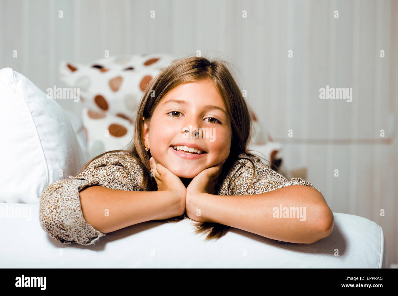little cute real girl at home interior smiling Stock Photo - Alamy