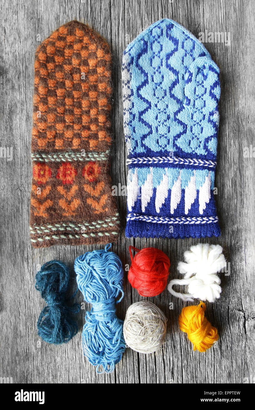 teamwork colored yarn balls making mittens on board background Stock ...