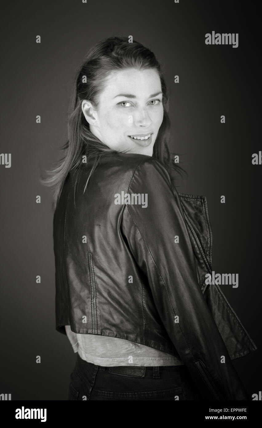Model in studio isolated on plain grey background Stock Photo - Alamy