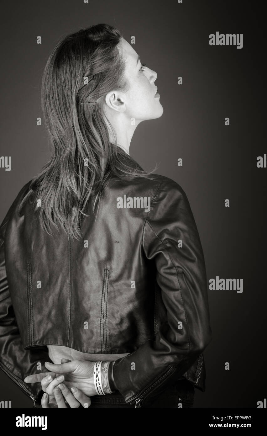 Model in studio isolated on plain grey background Stock Photo - Alamy