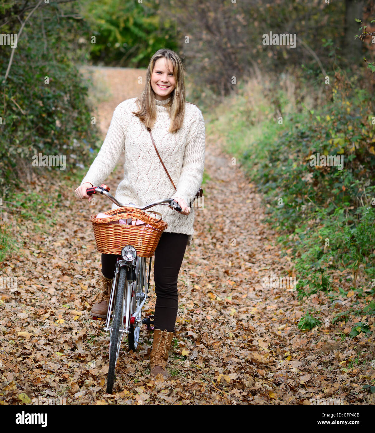 Beautiful woman enjoying nature driving bicycle Stock Photo - Alamy