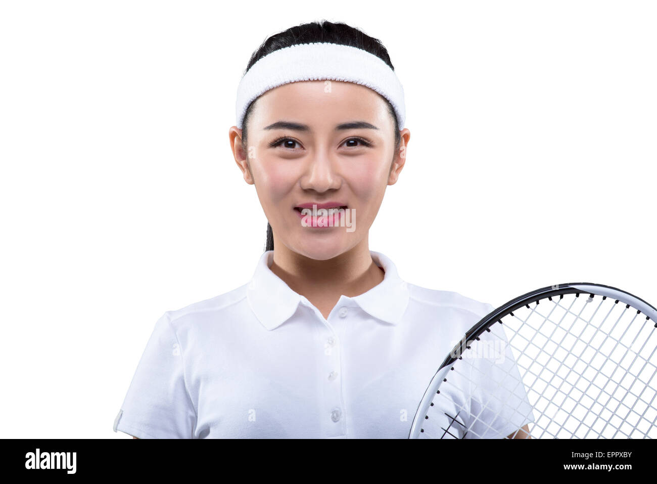 Young woman in tennis outfit holding racket Stock Photo - Alamy