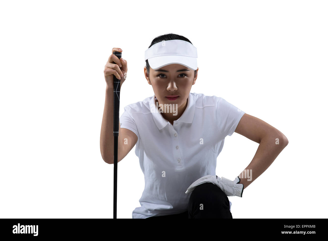 Young female golfer preparing to putt on golf course Stock Photo - Alamy